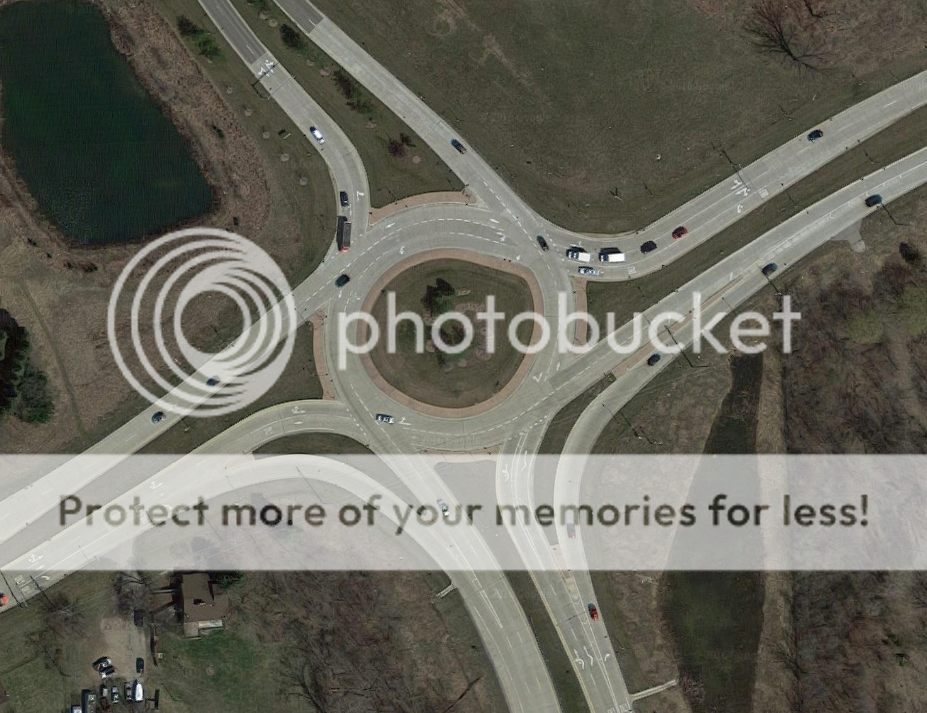 Examples of 4+ lane roads intersecting at a roundabout
